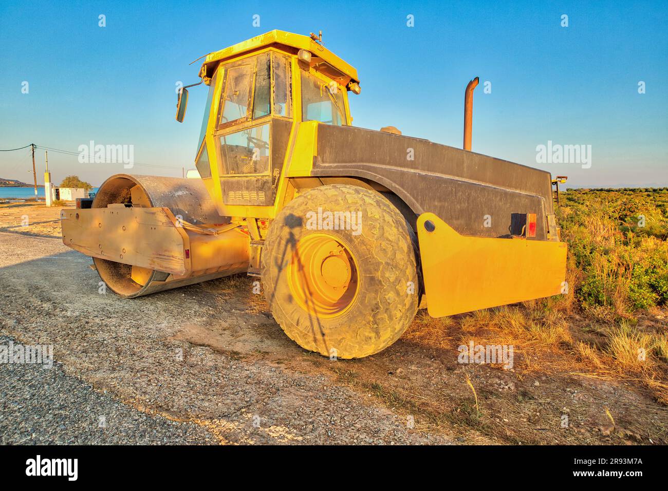 Perspective view of steamroller in a suggestive construction site ...