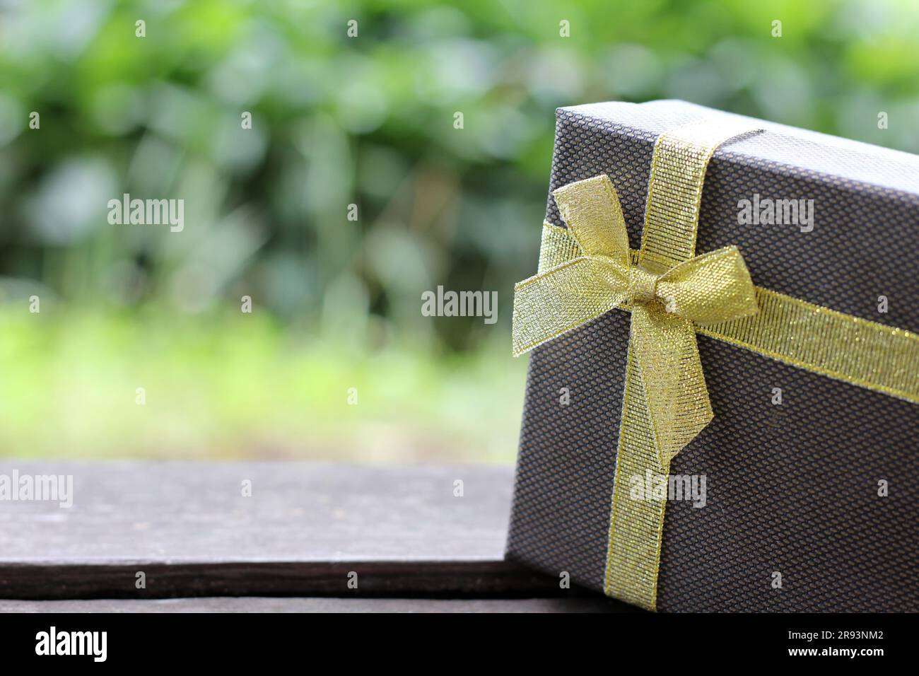 Various shots of gift boxes with sunlight on the park lawn on a summer ...