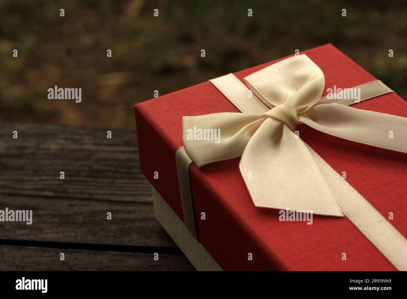 Various shots of gift boxes with sunlight on the park lawn on a summer ...
