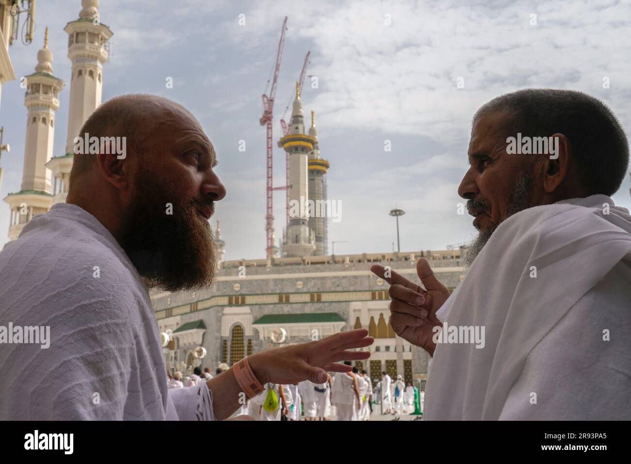 Russian pilgrim Artur Aslanov, left, chats with Mauritanian pilgrim ...