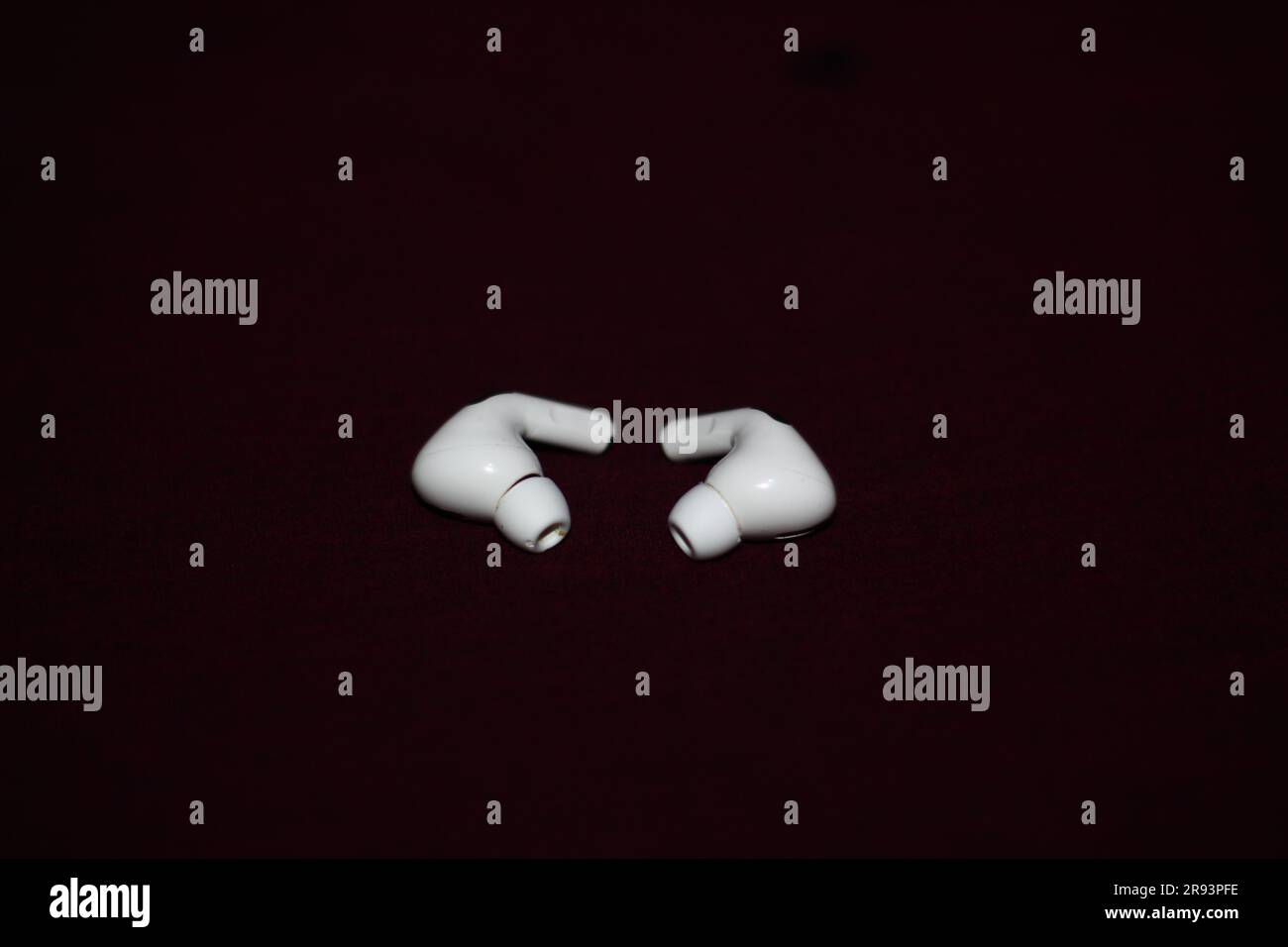 Close up Shot of wireless earbuds wireless earphones isolated on black ...