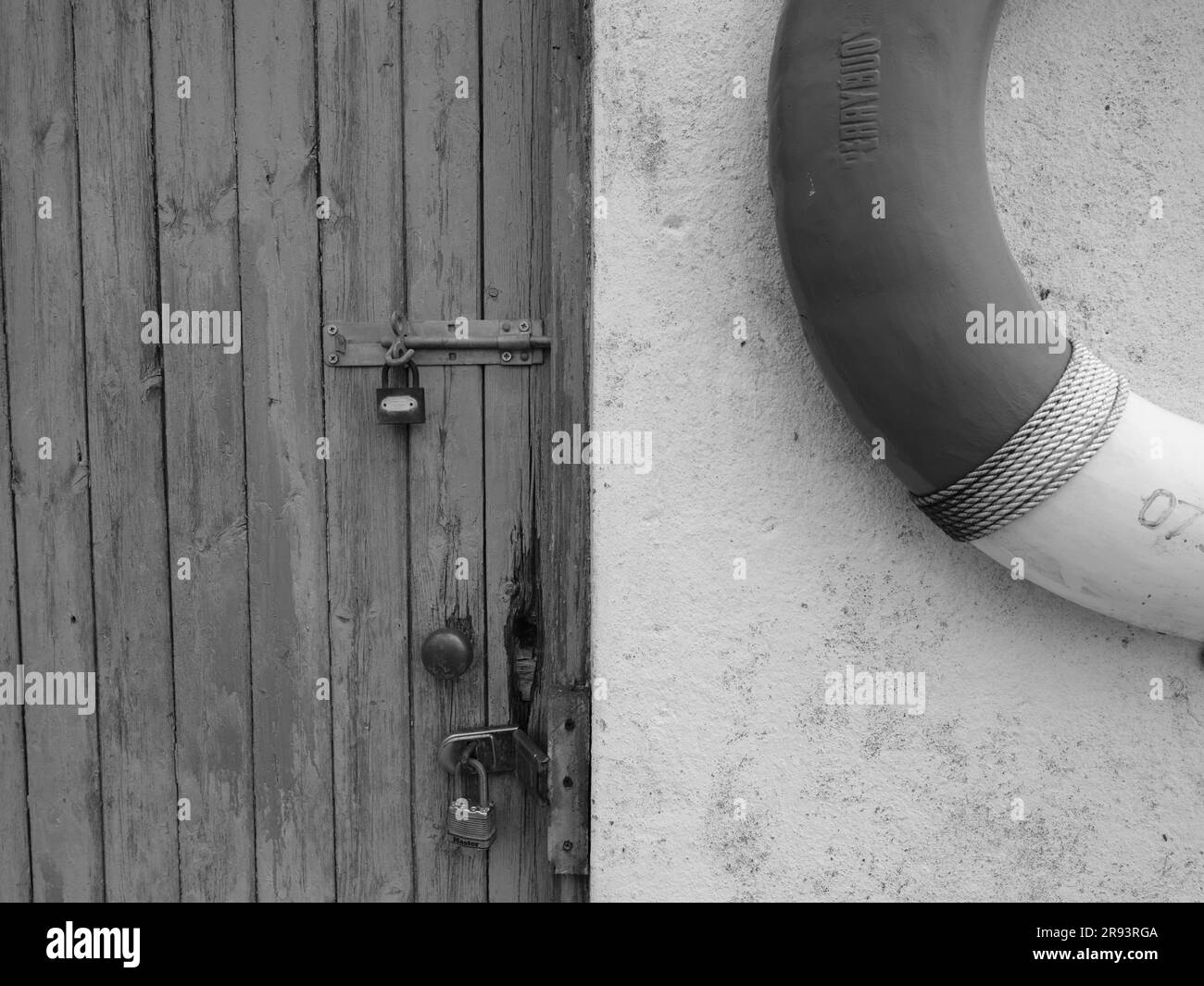 LIFEBUOY AND WEATHERED DISTRESSED BLUE DOOR NEWLYN HARBOUR Stock Photo ...