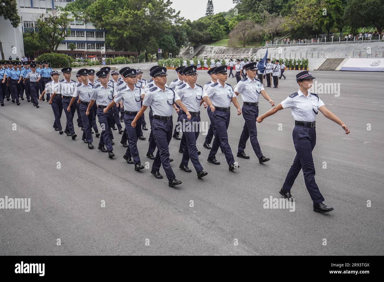 The police officers march during the parade. A police passing out ...