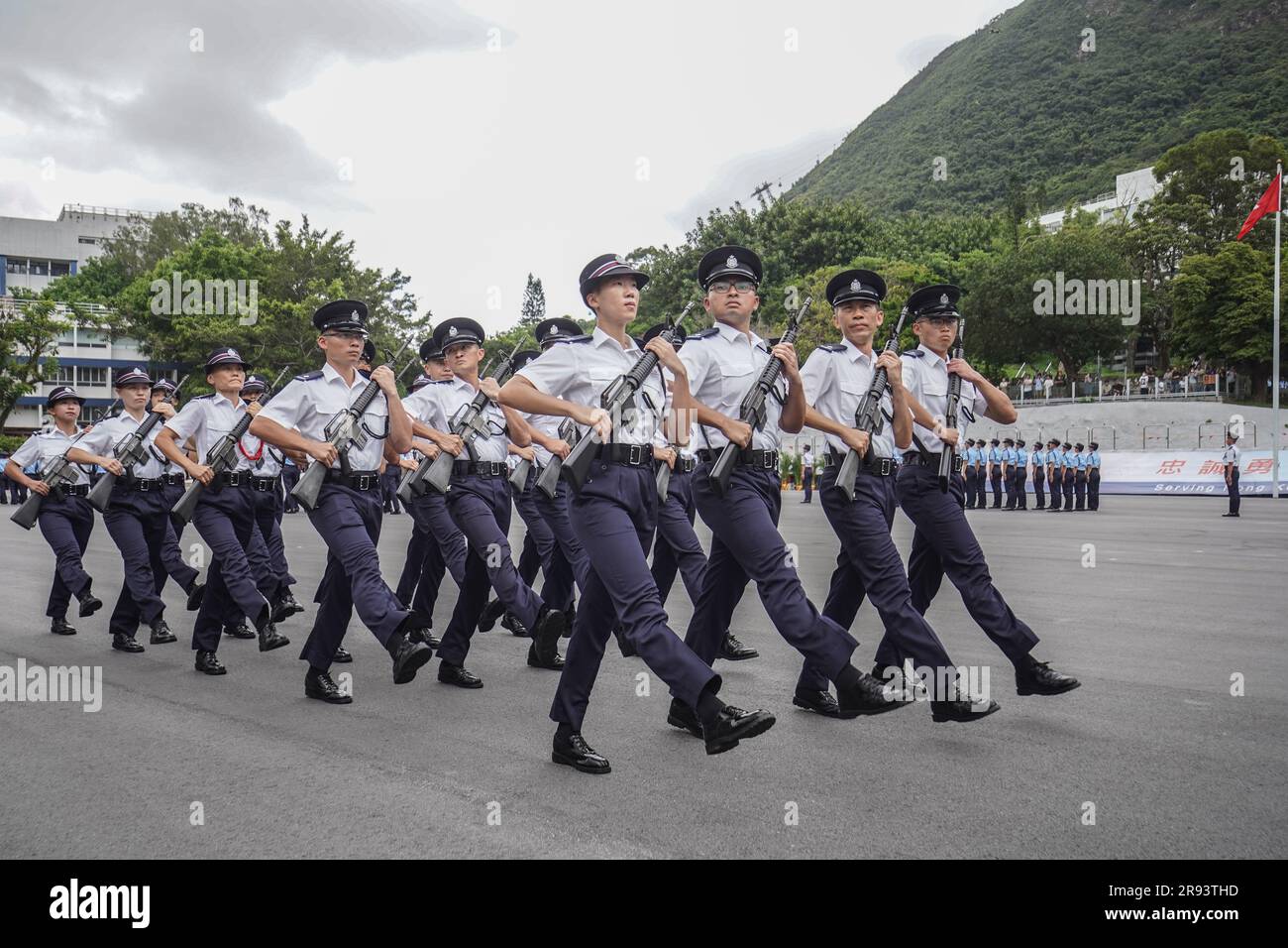 The police officers march during the parade. A police passing out ...