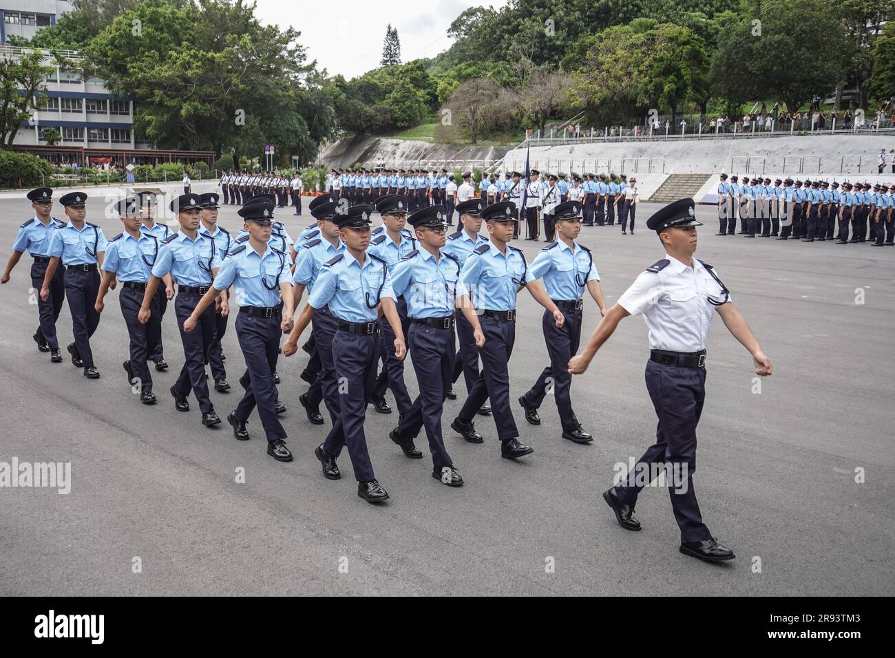 The police officers march during the parade. A police passing out ...