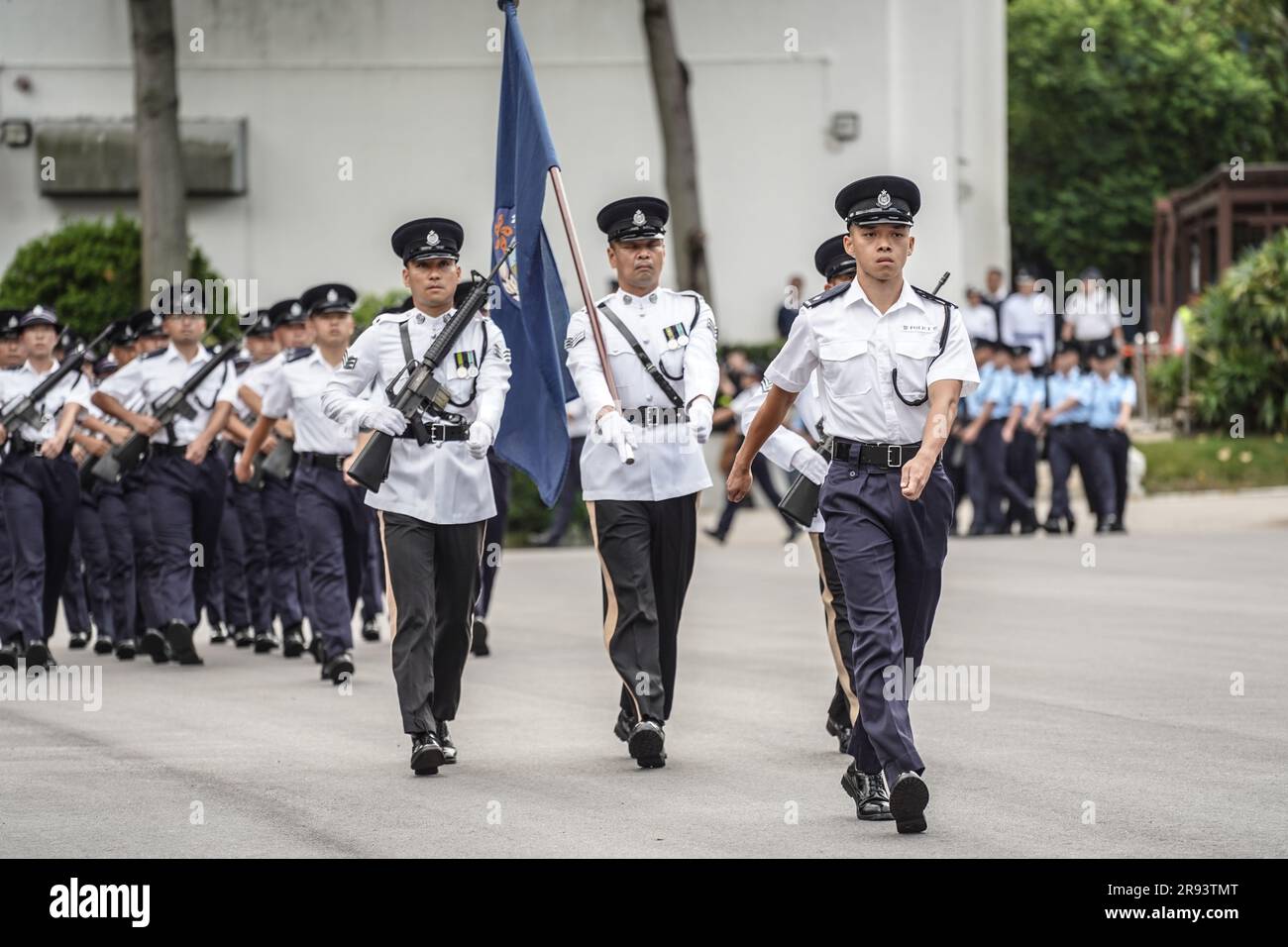 The police officers march during the parade. A police passing out ...
