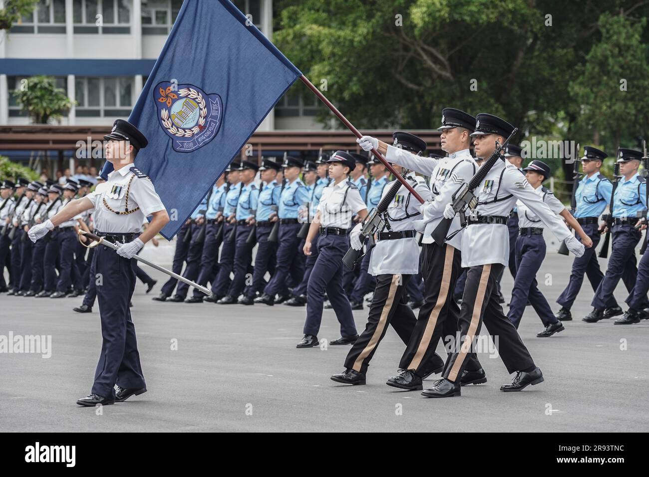 The police officers march with the flag of Hong Kong Police Force ...