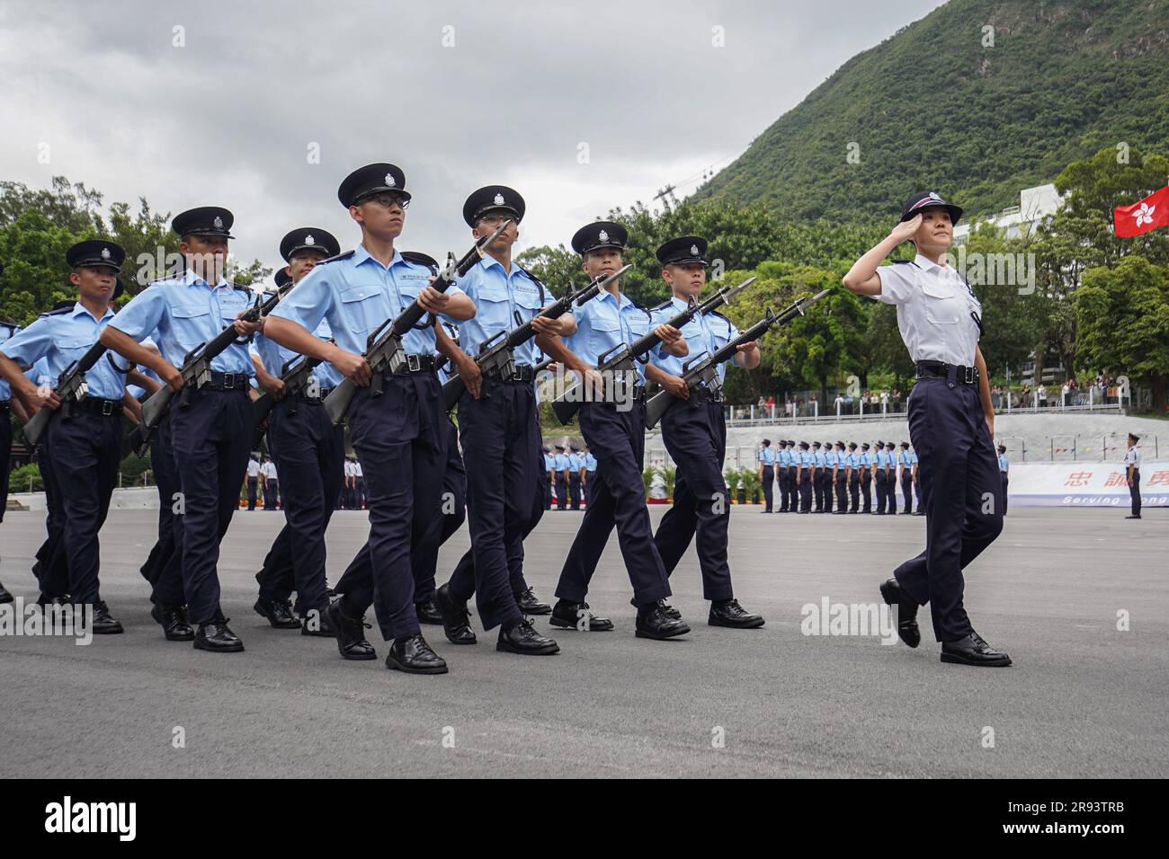 The police officers march during the parade. A police passing out ...