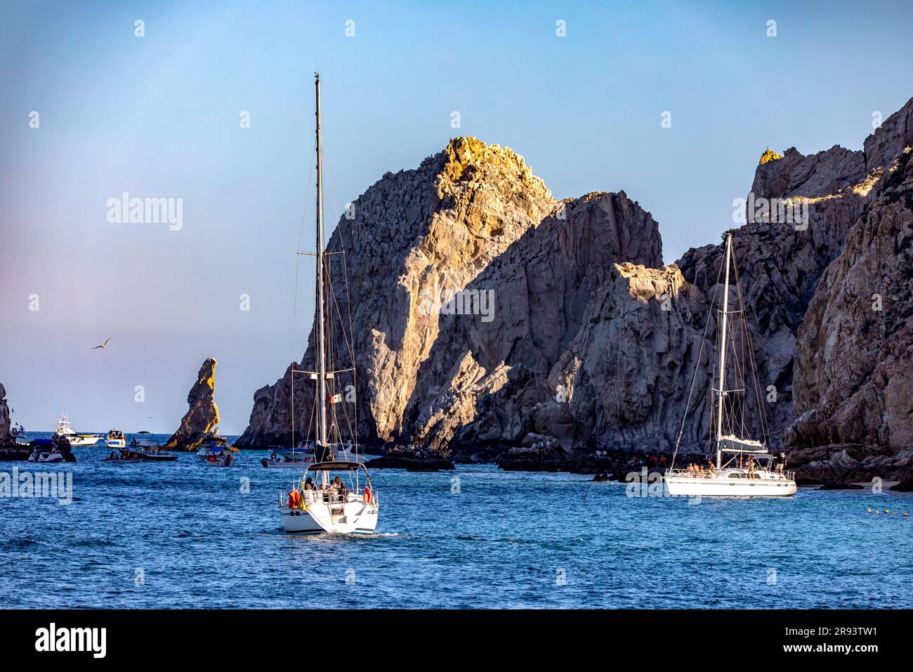 Boats sailing towards Cabo San Lucas Arch and Love Beach in the Sea of ...