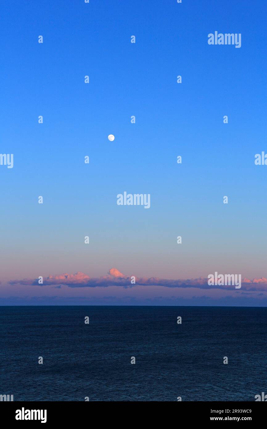 Sunset view of the sea and the rising moon of Erimo Cape Stock Photo ...