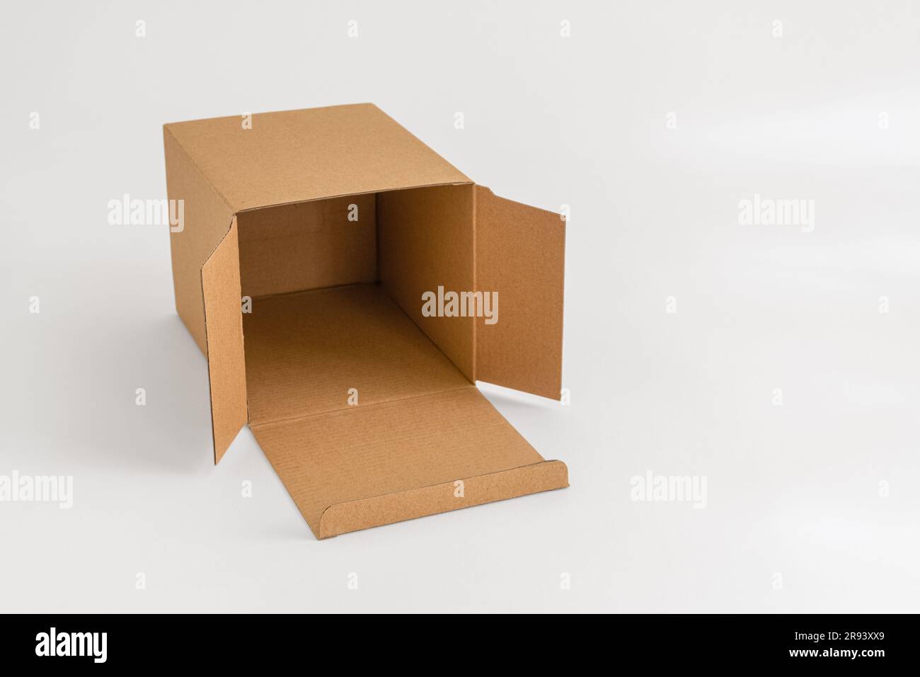 Empty cardboard box isolated on the white background Stock Photo - Alamy