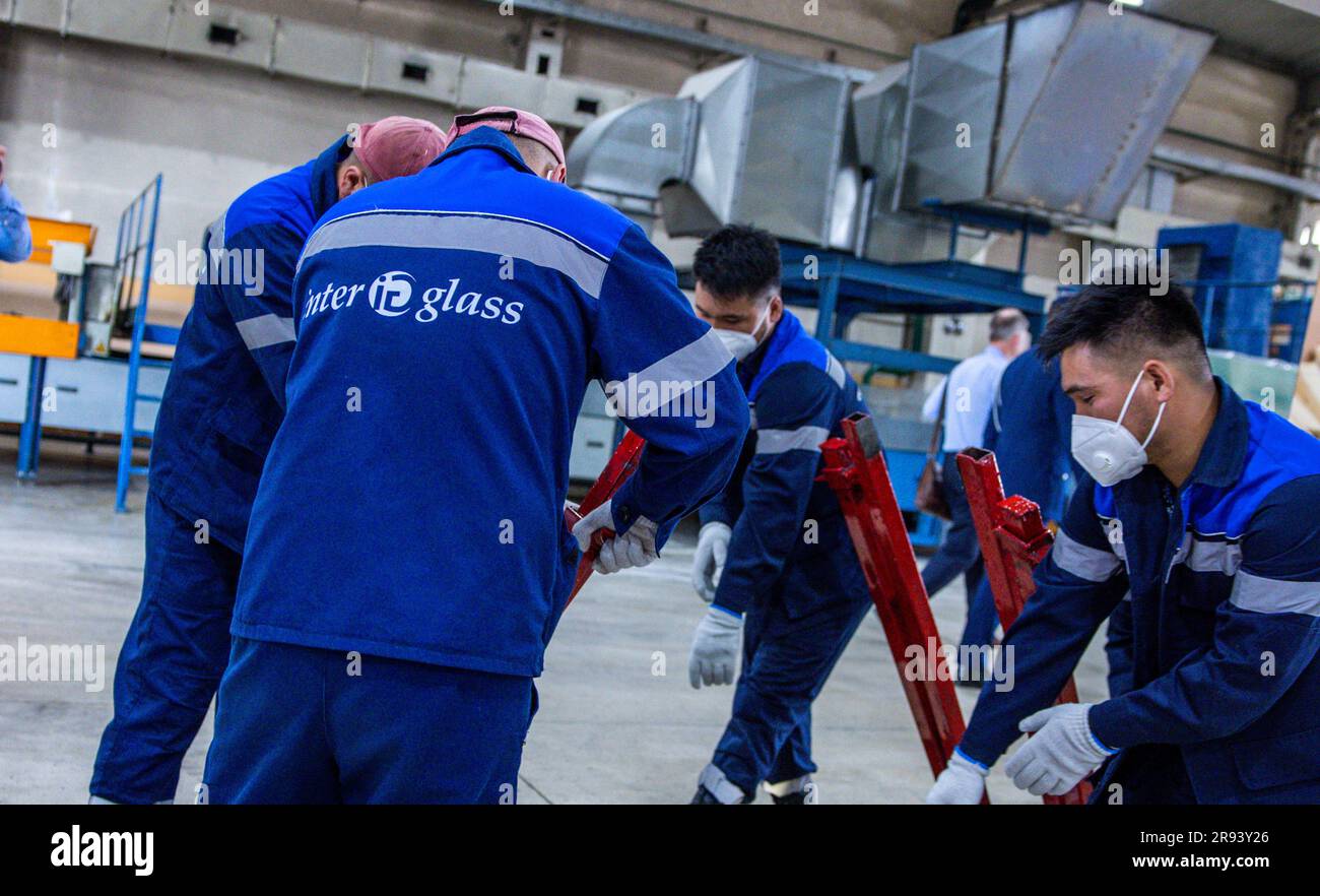 Tokmok, Kyrgyzstan. 22nd June, 2023. Female employees check an employee ...