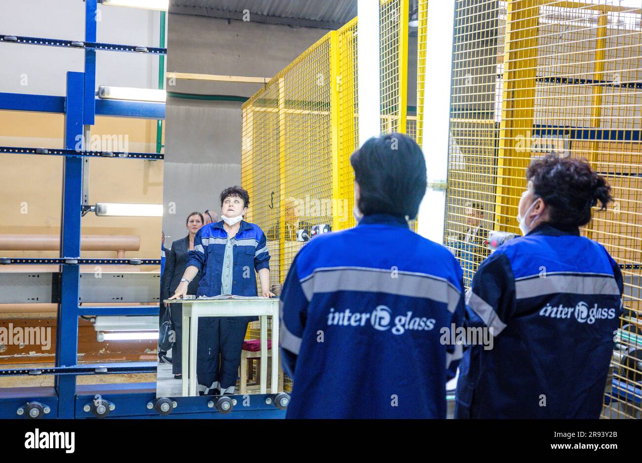 Tokmok, Kyrgyzstan. 22nd June, 2023. Female employees inspect a mirror ...