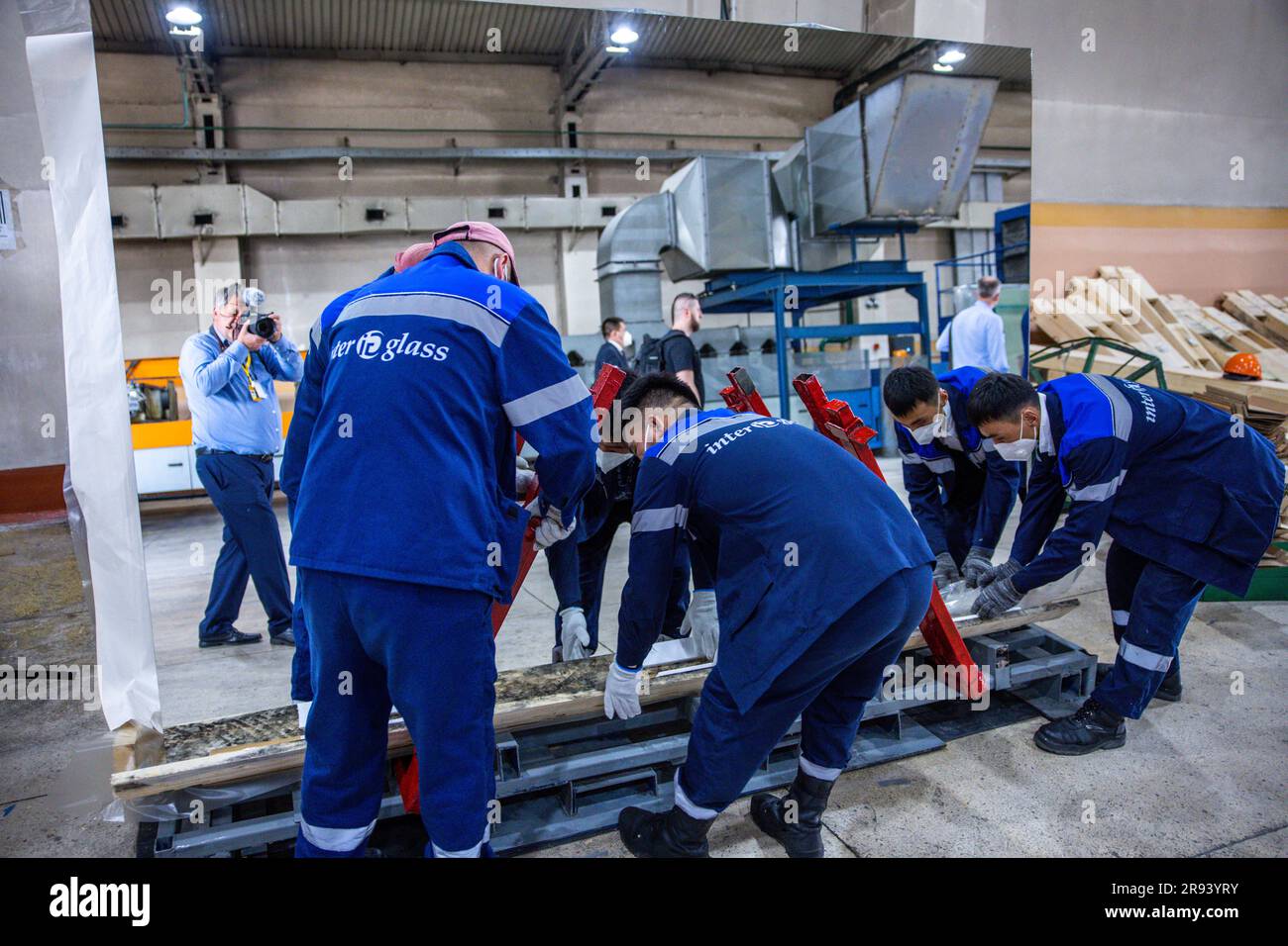 Tokmok, Kyrgyzstan. 22nd June, 2023. Female employees check an employee ...