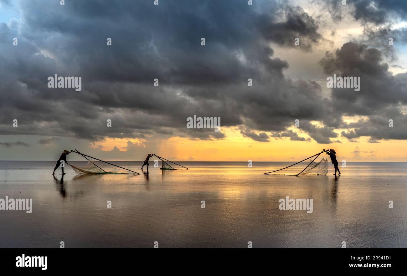 The image of fishermen in the fishing village using homemade tools to ...