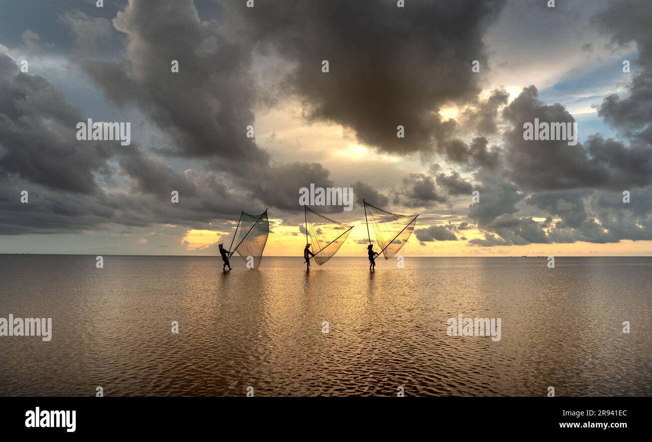The image of fishermen in the fishing village using homemade tools to ...