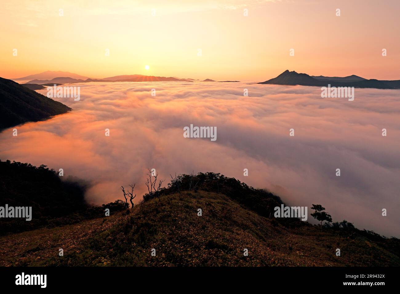 Lake Mashu and Mt. Mashu in the Mist at Sunrise Stock Photo - Alamy