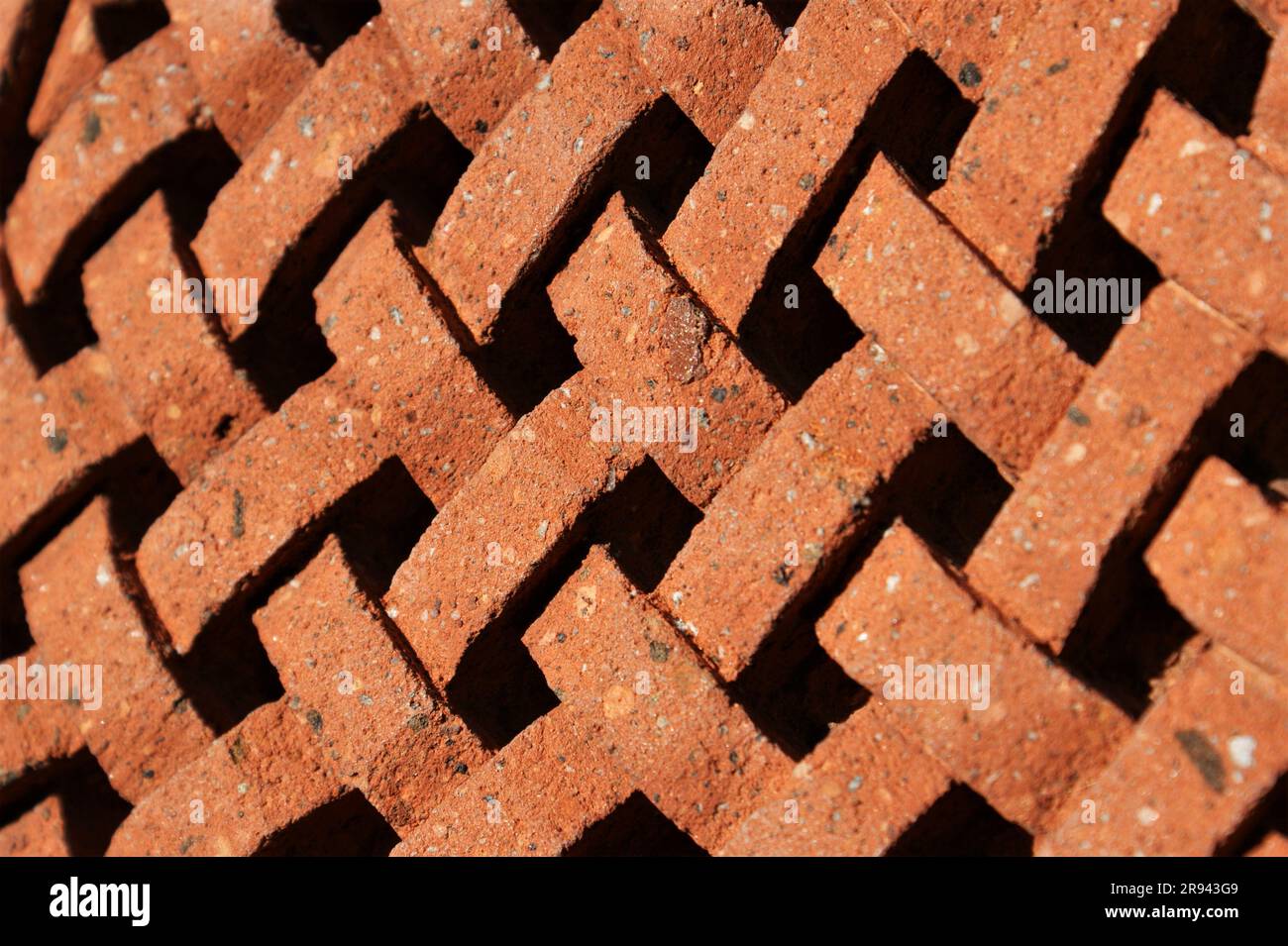 The structure of the braid is carved into the stone. Brown background ...