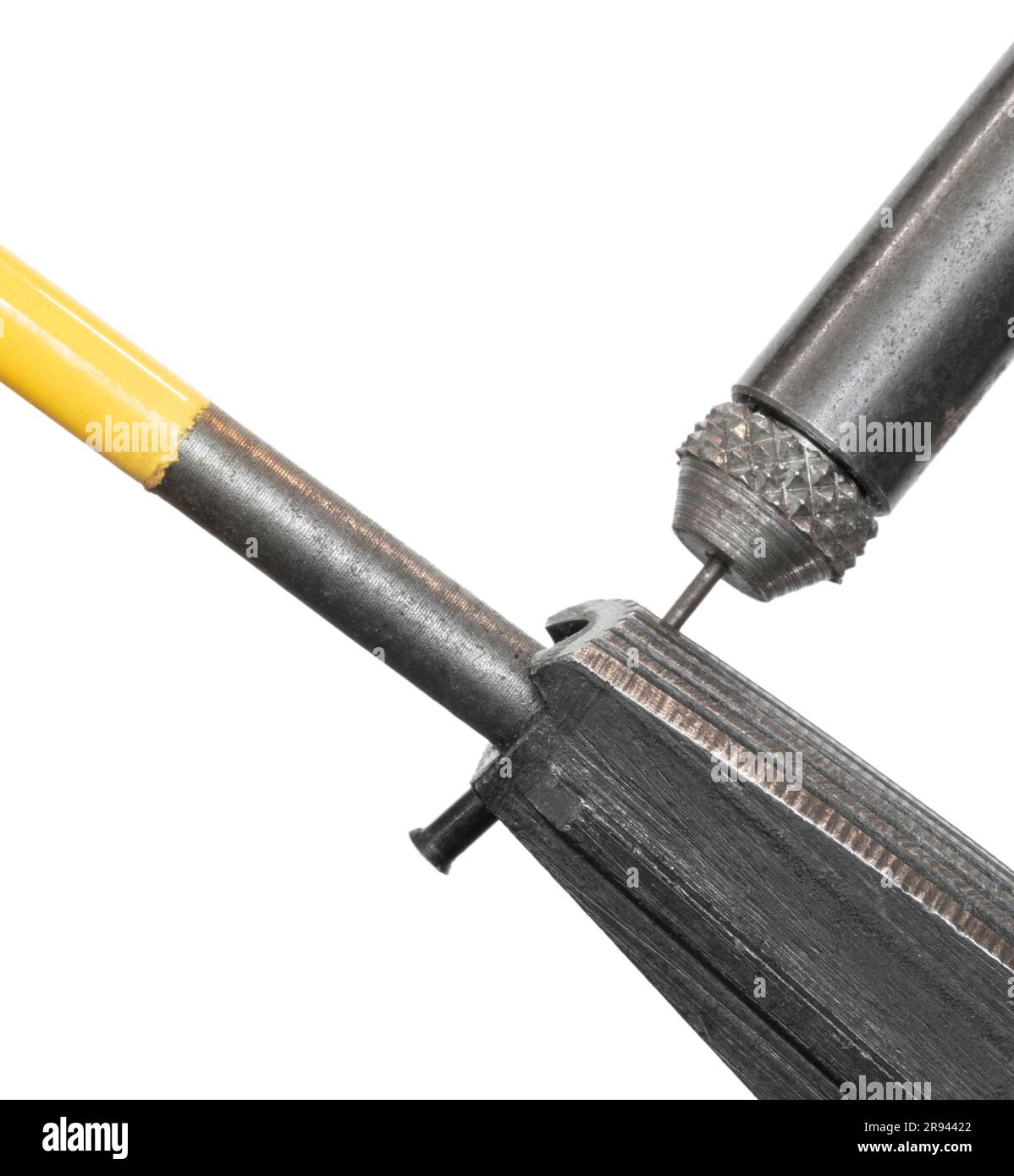 Two punches removing the mainspring on a semi auto handgun Stock Photo ...