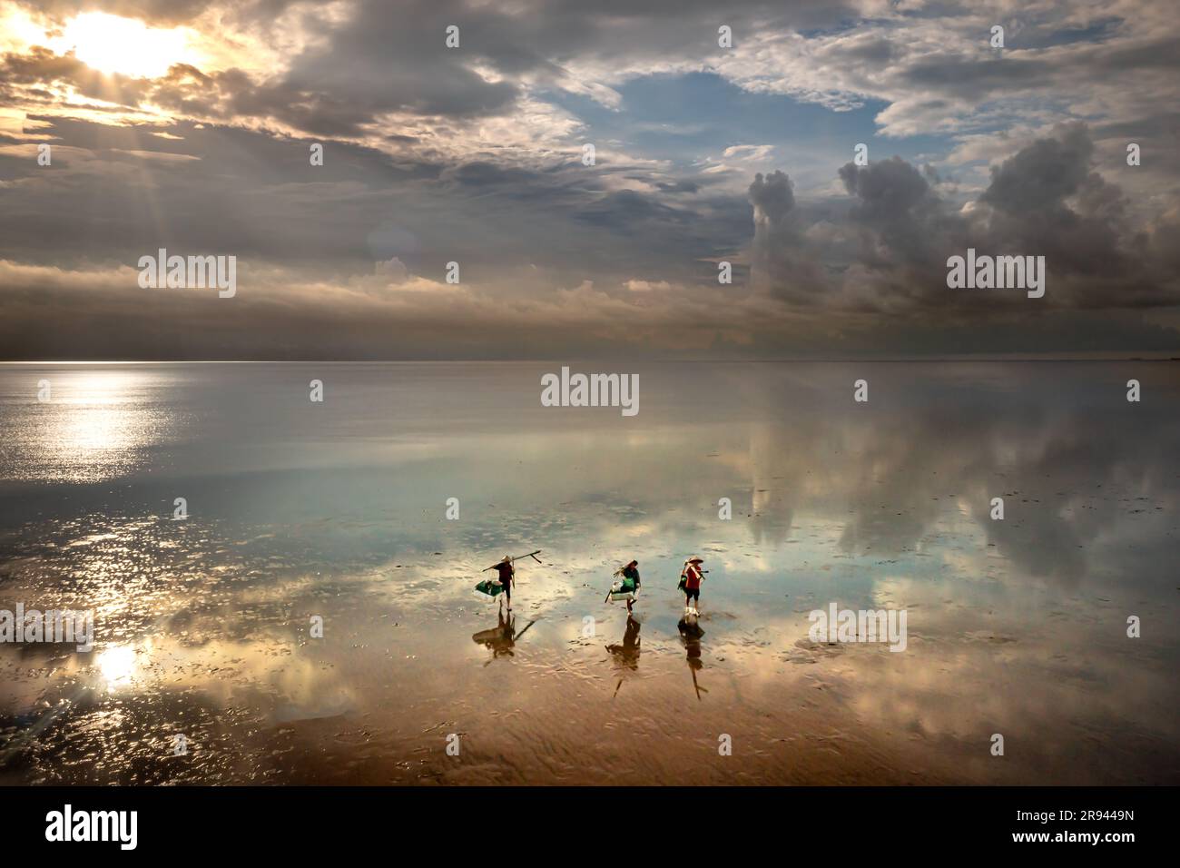 The image of fishermen in the fishing village using homemade tools to ...