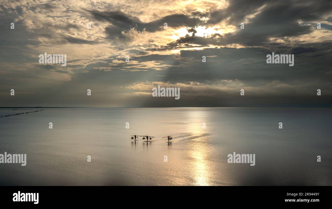 The image of fishermen in the fishing village using homemade tools to ...