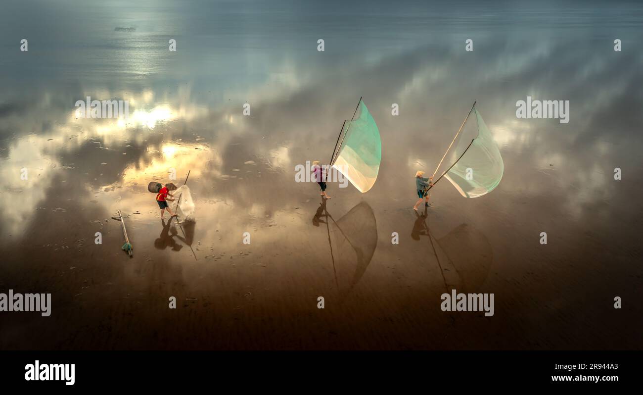 The image of fishermen in the fishing village using homemade tools to ...