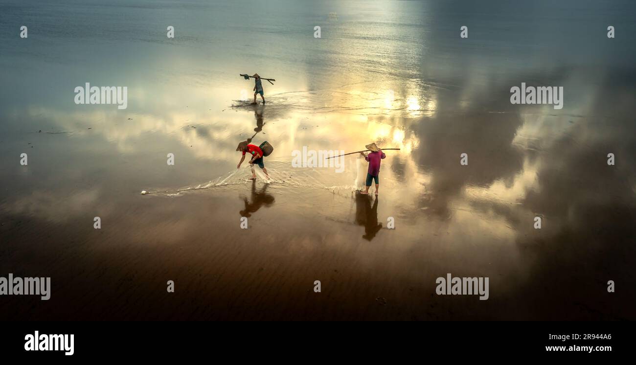 The image of fishermen in the fishing village using homemade tools to ...