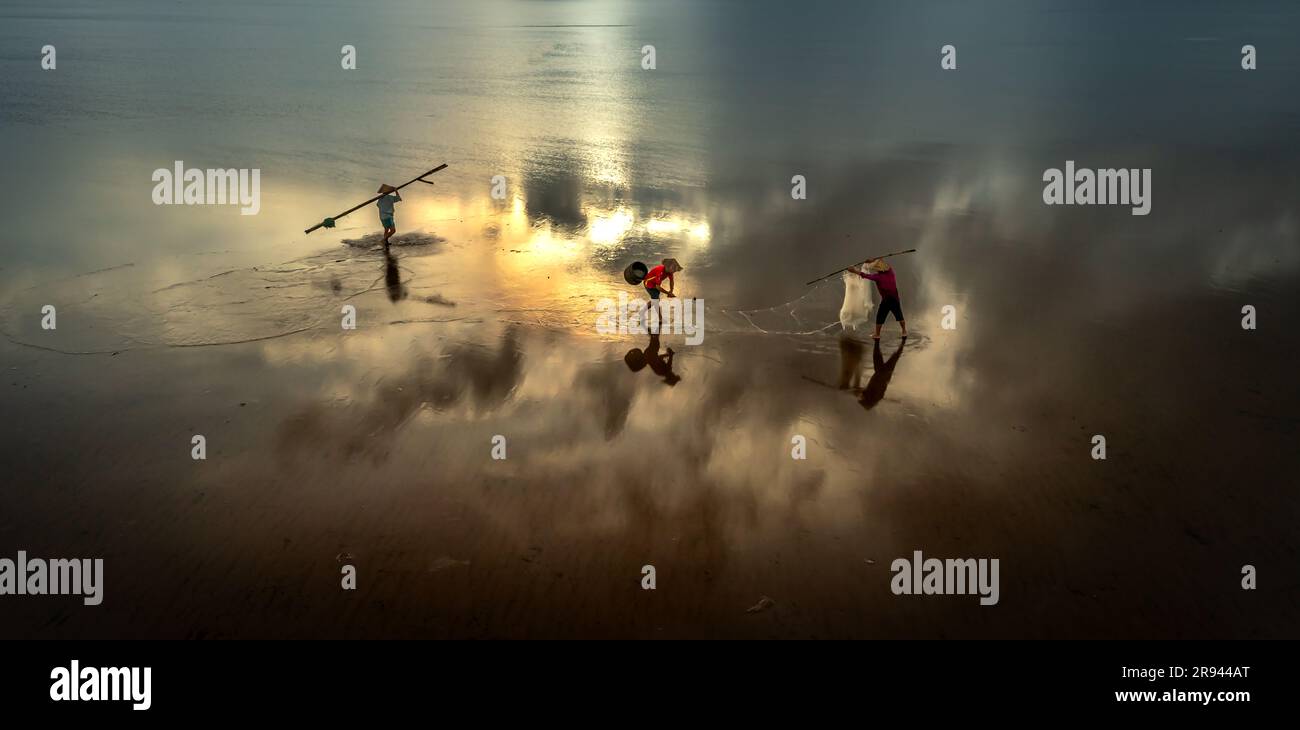 The image of fishermen in the fishing village using homemade tools to ...