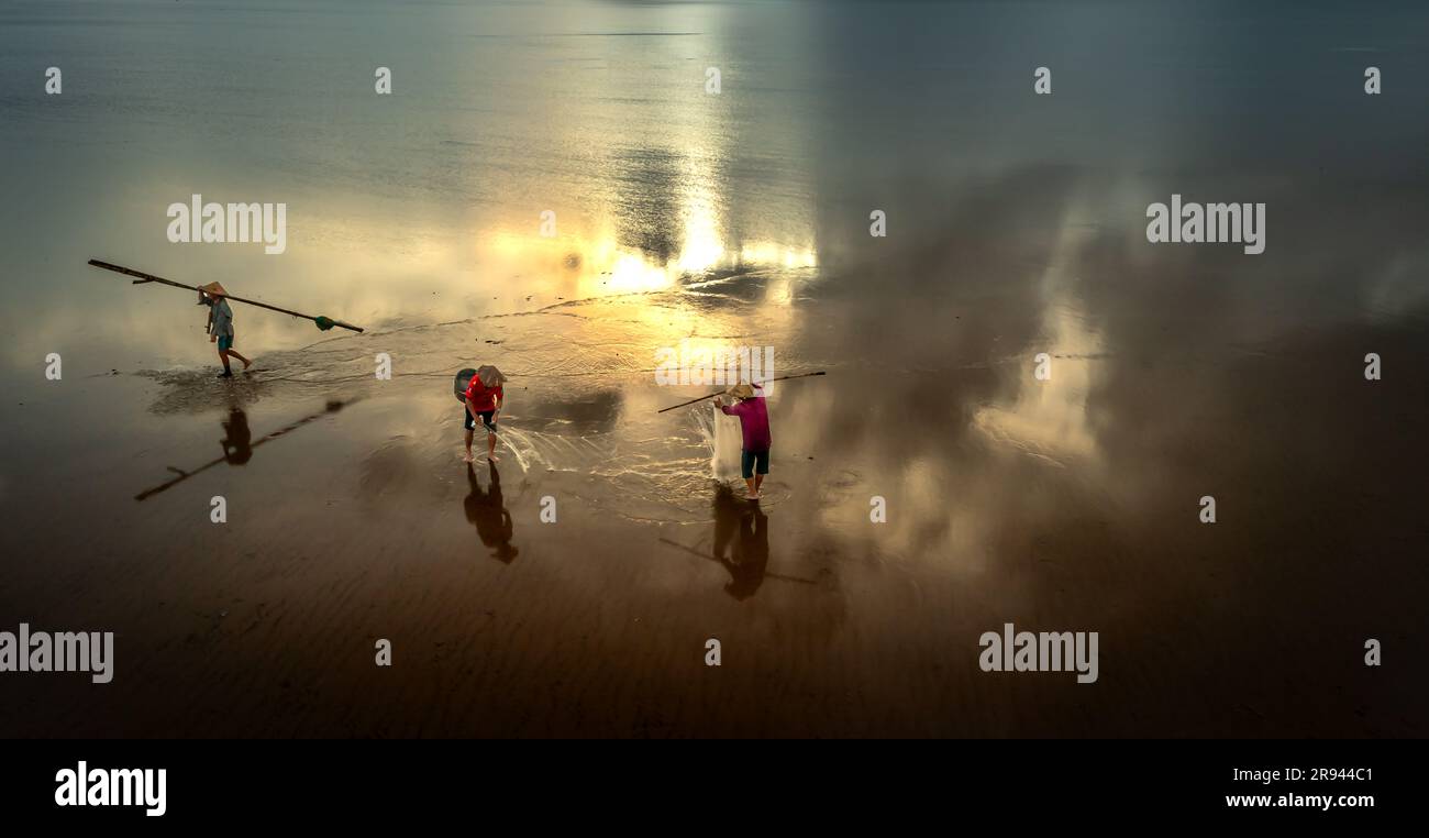 The image of fishermen in the fishing village using homemade tools to ...