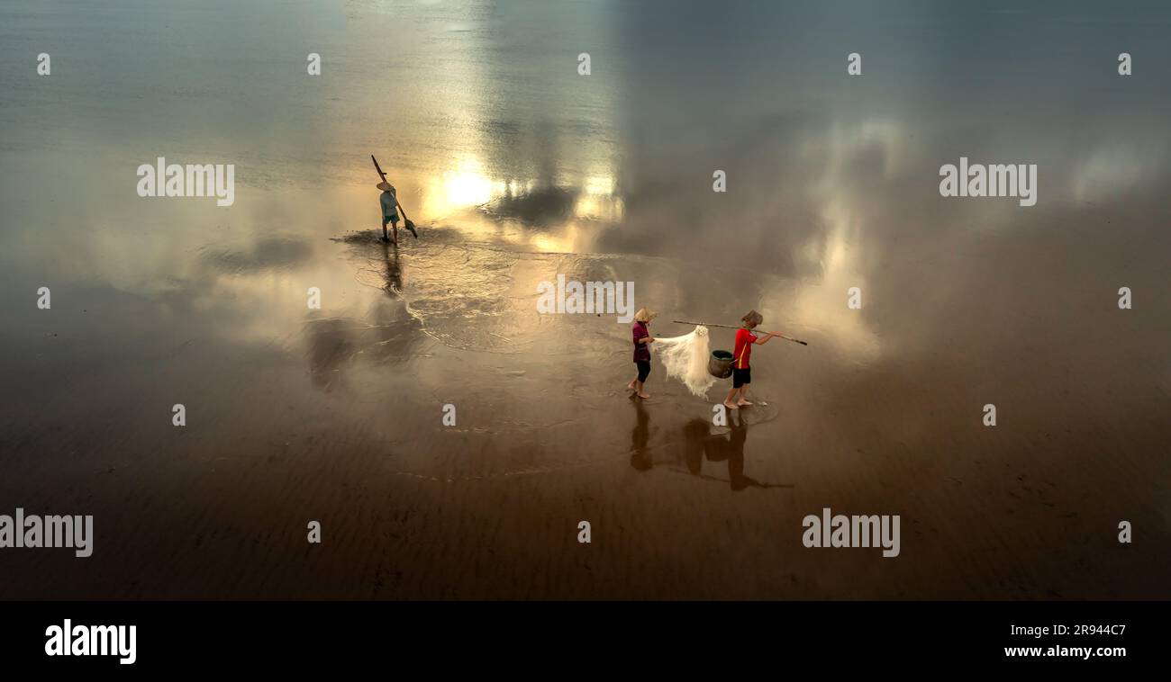 The image of fishermen in the fishing village using homemade tools to ...