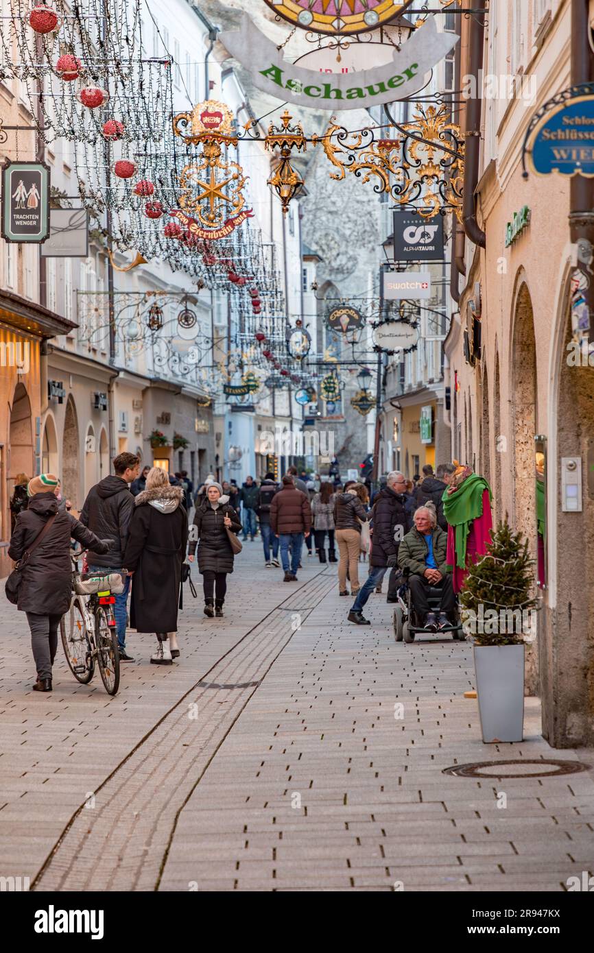 Salzburg, Austria - December 27, 2021: Getreidegasse is a busy shopping ...