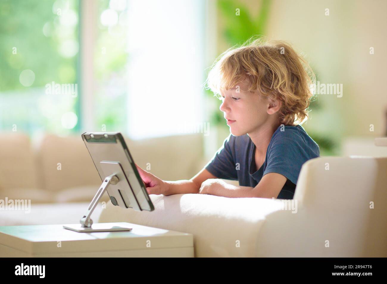 Kids with tablet computer. Child with pc watching movie or playing game ...