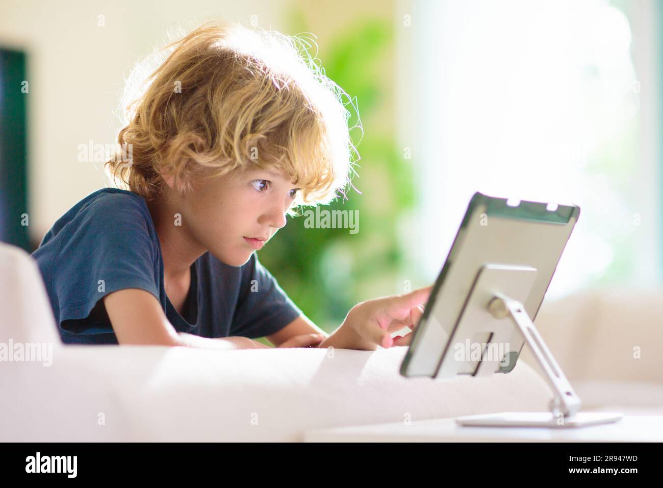 Kids with tablet computer. Child with pc watching movie or playing game ...