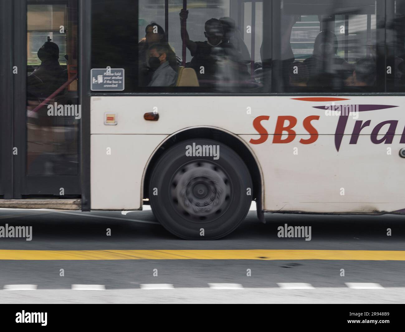 Close up of SBS Transit public bus driving on Singapore Road with ...