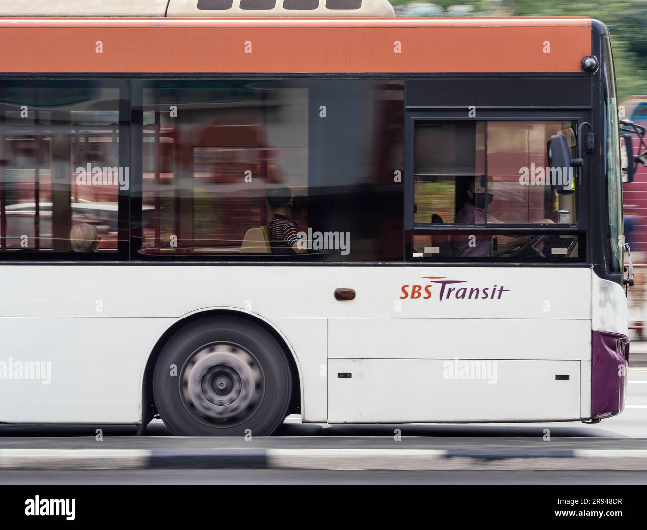 Close up of SBS Transit public bus driving on Singapore Road with ...