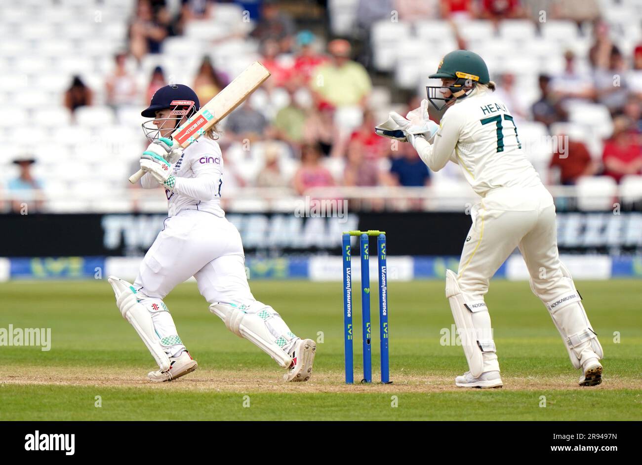 England's Tammy Beaumont (left) in action as Australia's Alyssa Healy ...