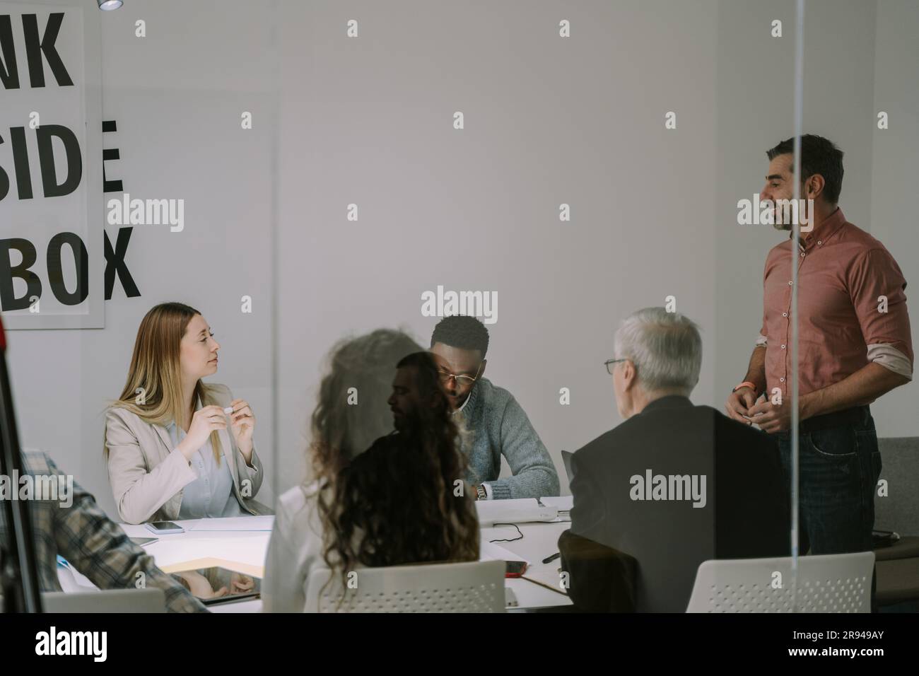 Diverse group of people discussing their project at the meeting room ...