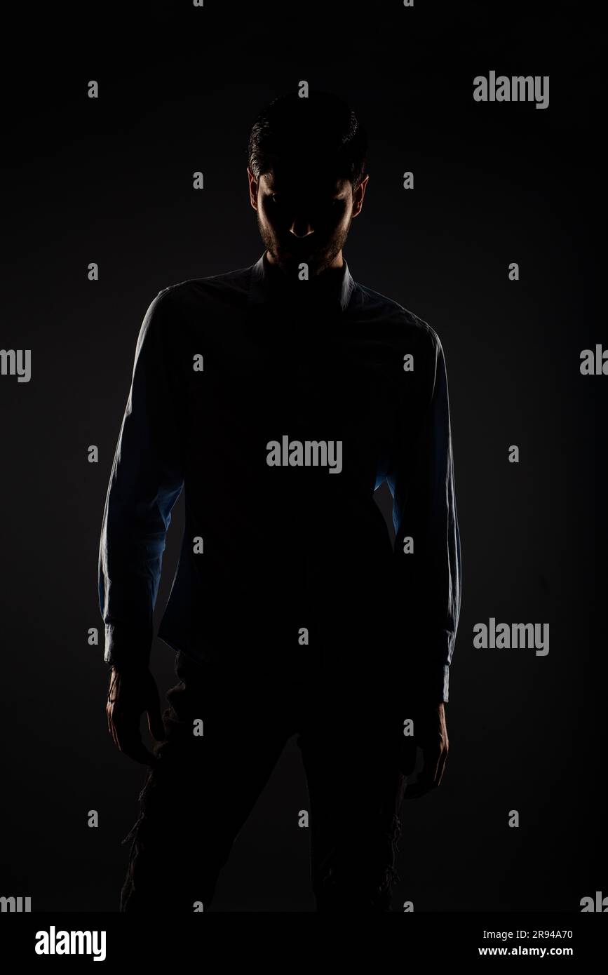 Dimmed light man hi-res stock photography and images - Alamy