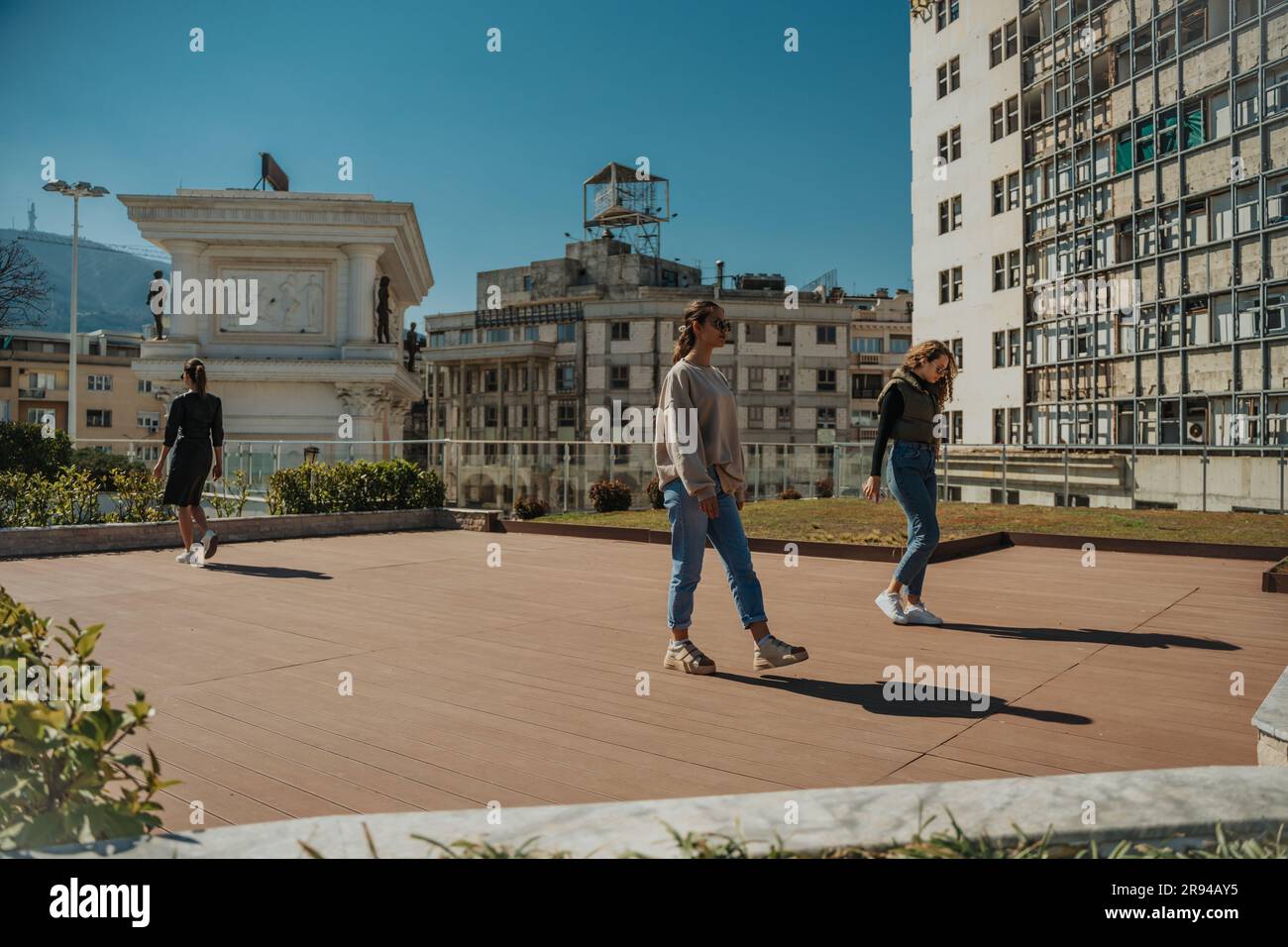 Three girls walking outdoors Stock Photo - Alamy