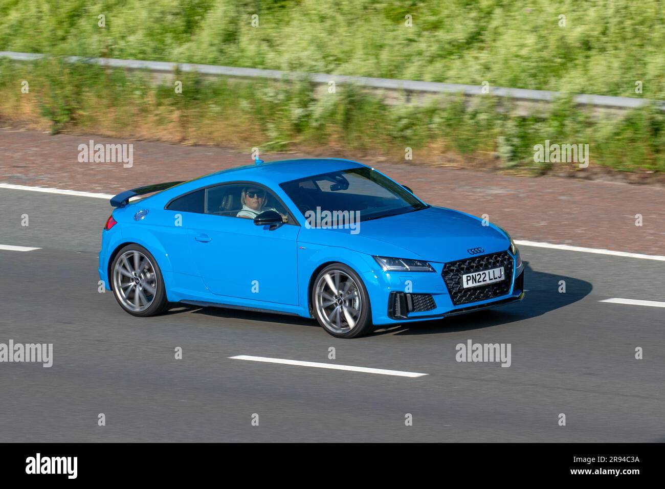 2022 Blue Audi TT S Line Black ED 40 TFS; travelling at speed on the M6 motorway in Greater ...