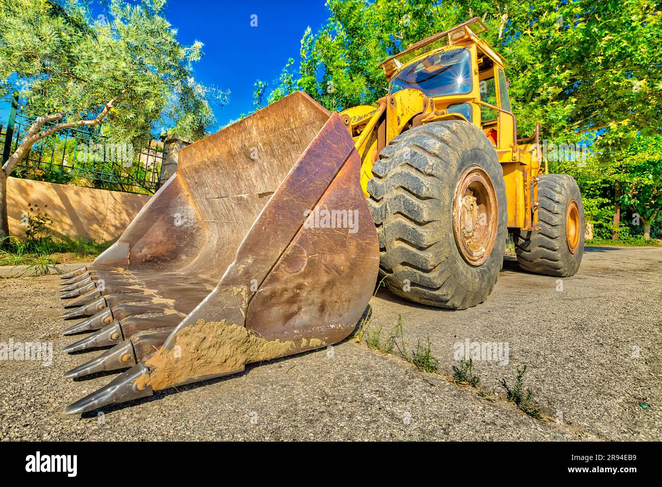 Wide angle and perspective view of heavy and powerful yellow bulldozer ...