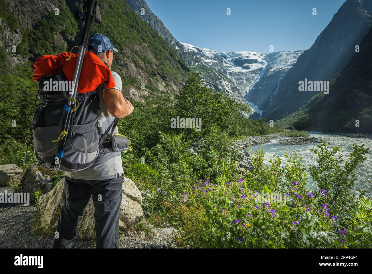 Caucasian Hiker in His 40s Taking Quick Look on a Scenic Kjenndal Glacier Valley. Norwegian ...