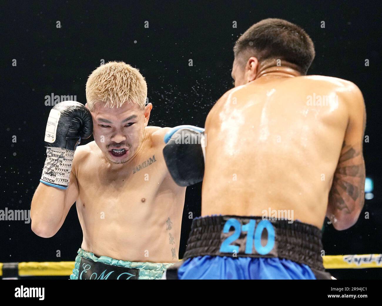 Japan's Kazuto Ioka (L) throws a punch at Joshua Franco of the United ...