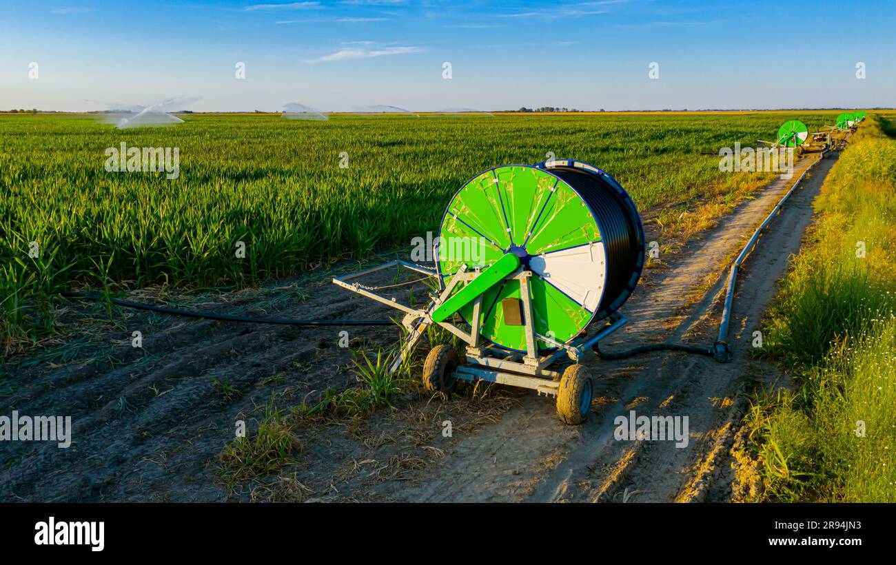 Above view on big bobbin, coil with rolled up plastic hose of ...