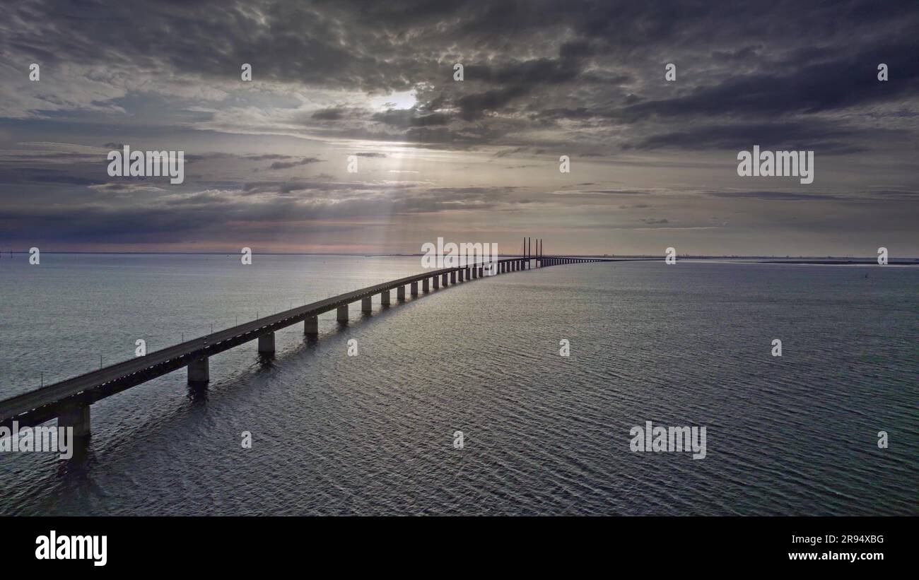 An aerial view of the sunset at the bridge over the Oresund strait ...