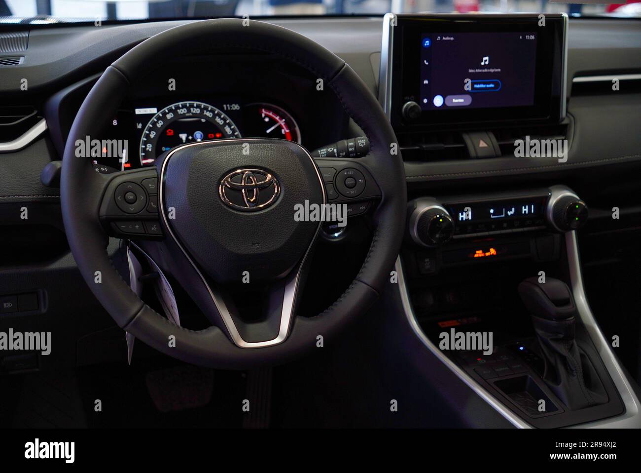 The interior of a Toyota car, featuring the steering wheel with the ...