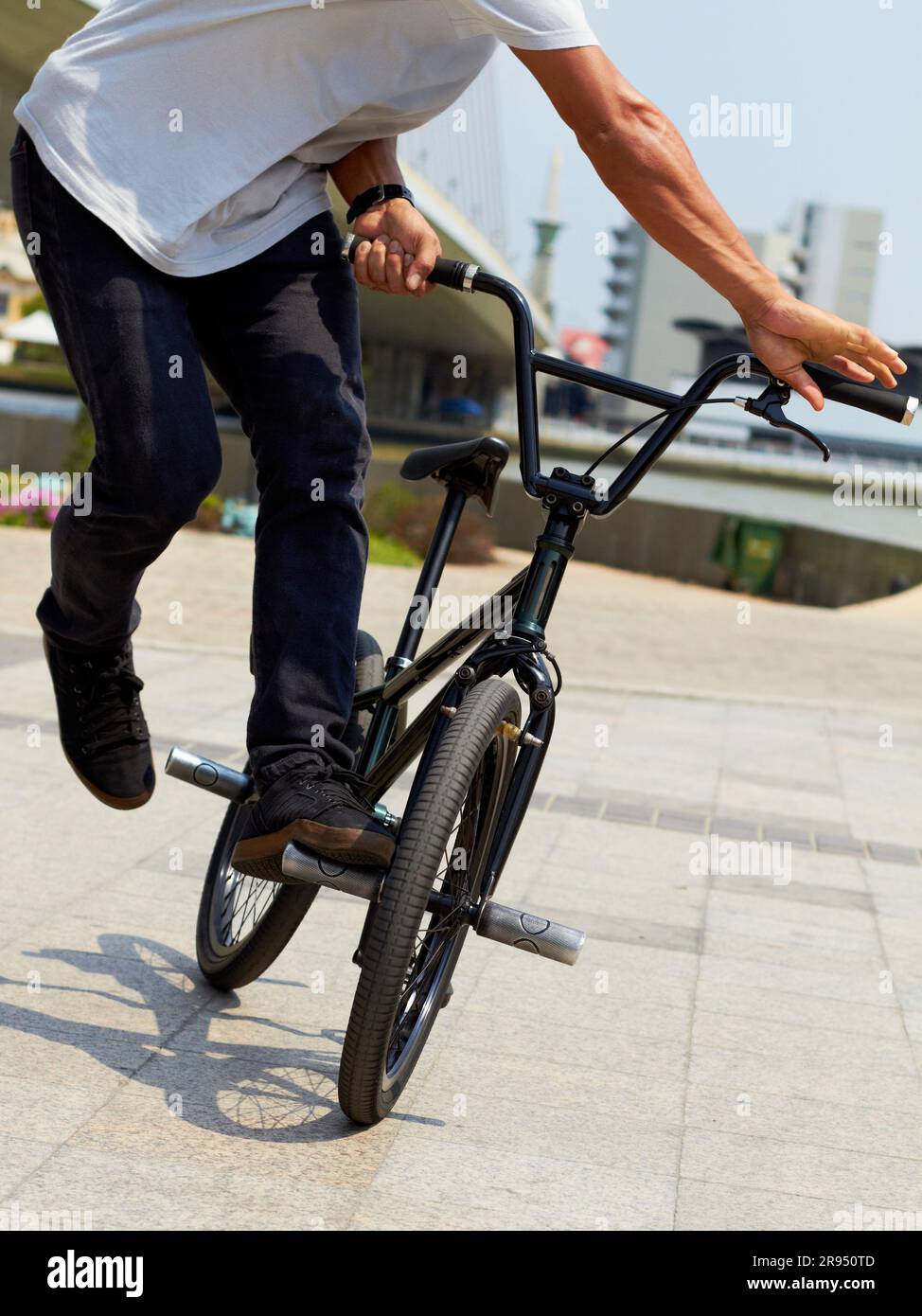 Bike, trick and closeup of man outdoor for sports, balance and action ...