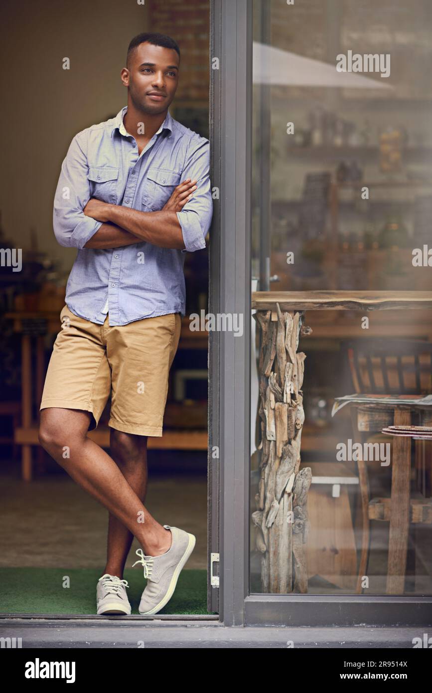 Coffee shop, thinking and man as small business owner at door for ideas ...