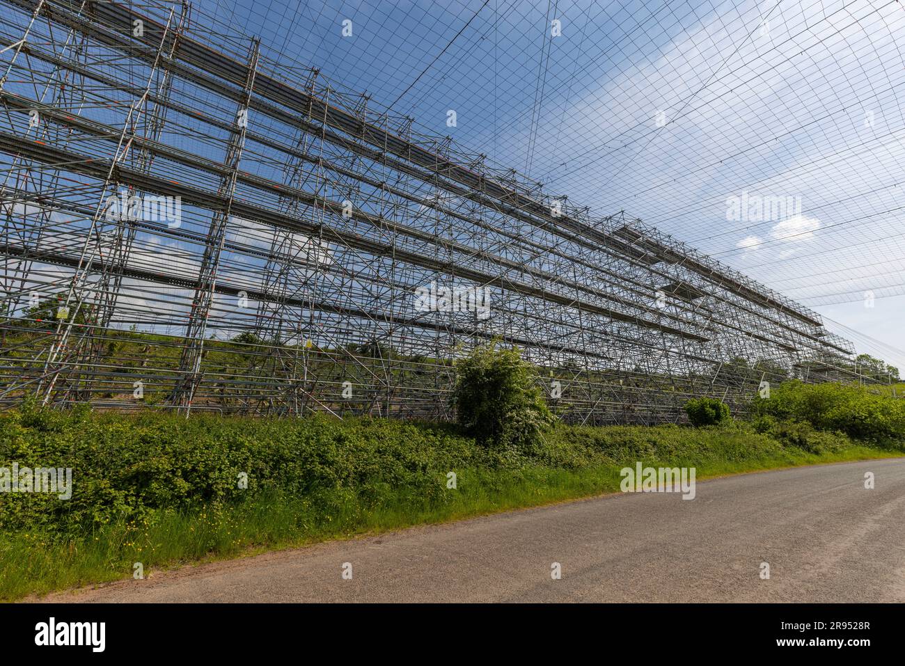 The scaffold tower structure used to hang a safety net over a road ...