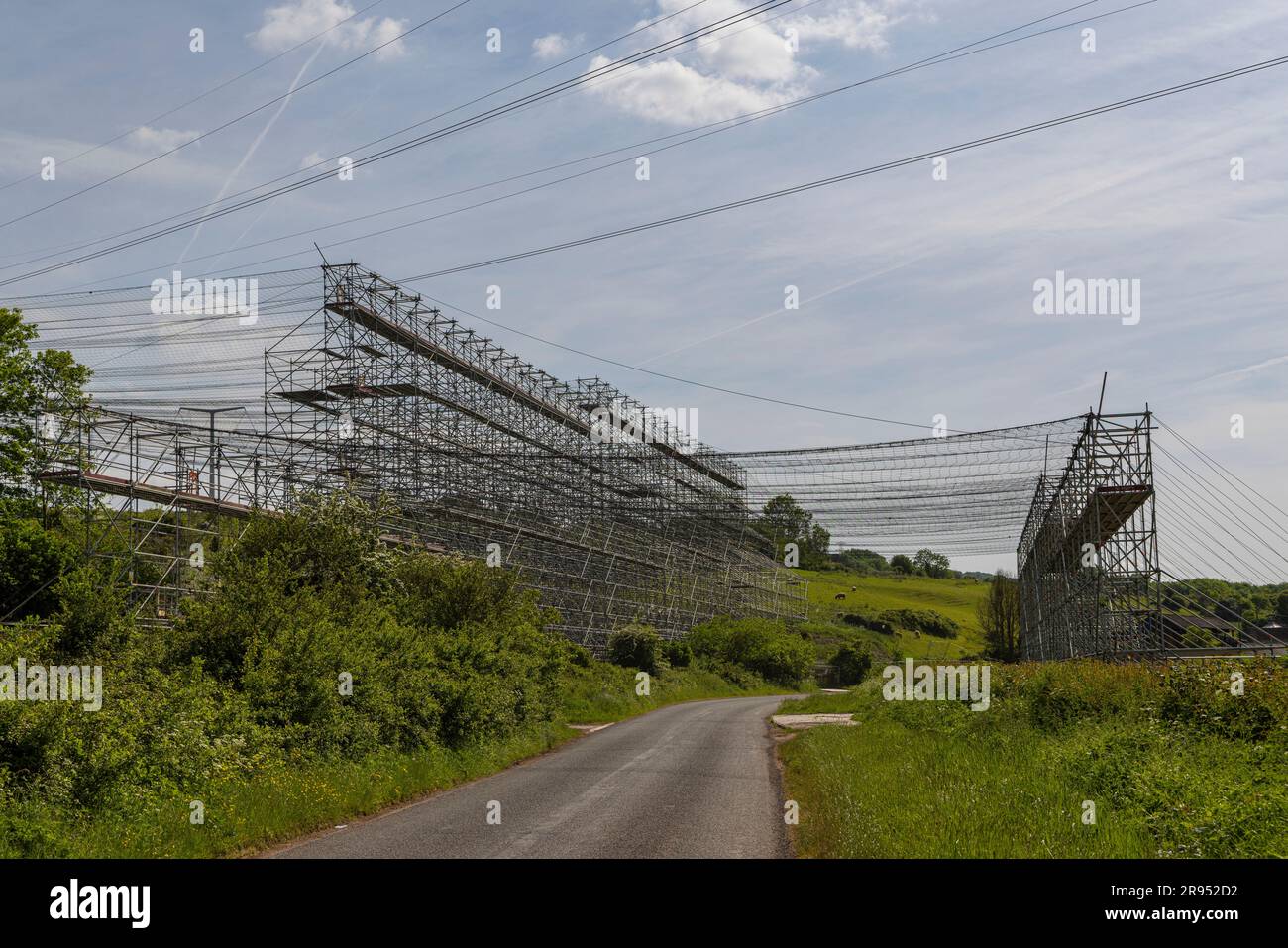 The scaffold tower structure used to hang a safety net over a road ...